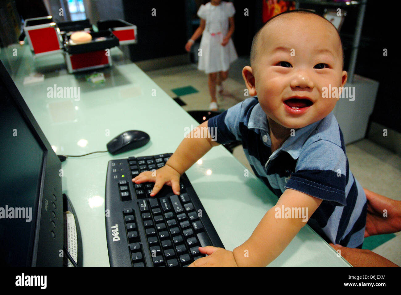 Baby boy playing on the keyboard of a computer, Shanghai, China Stock ...