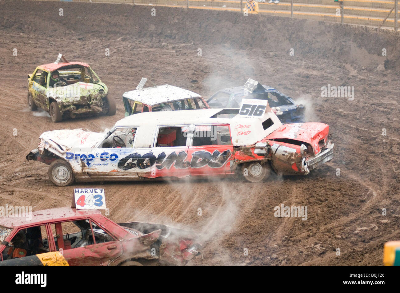 old limousine getting smashed up in a destruction derby Stock Photo - Alamy