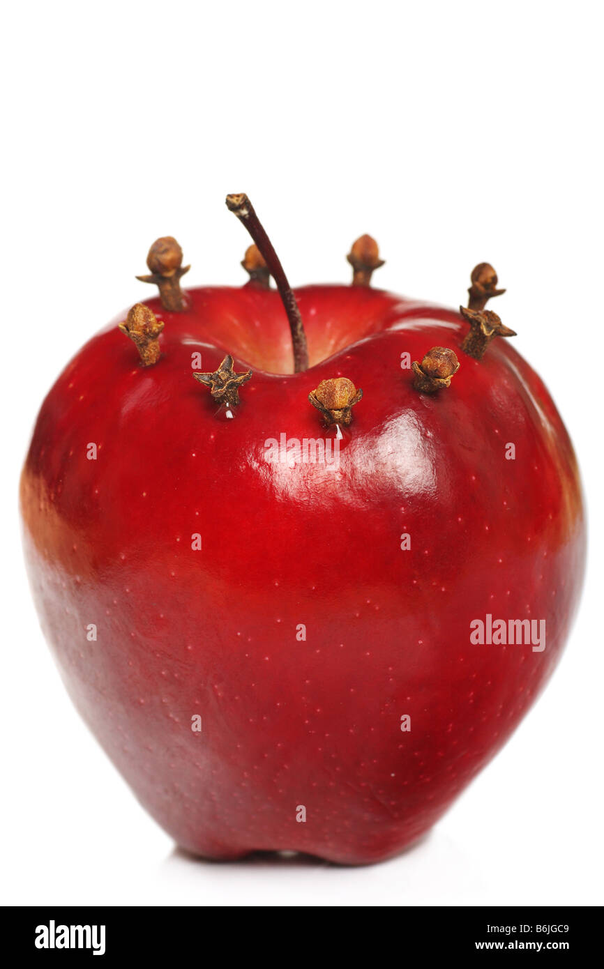 juicy red spiced apple with cloves Stock Photo - Alamy