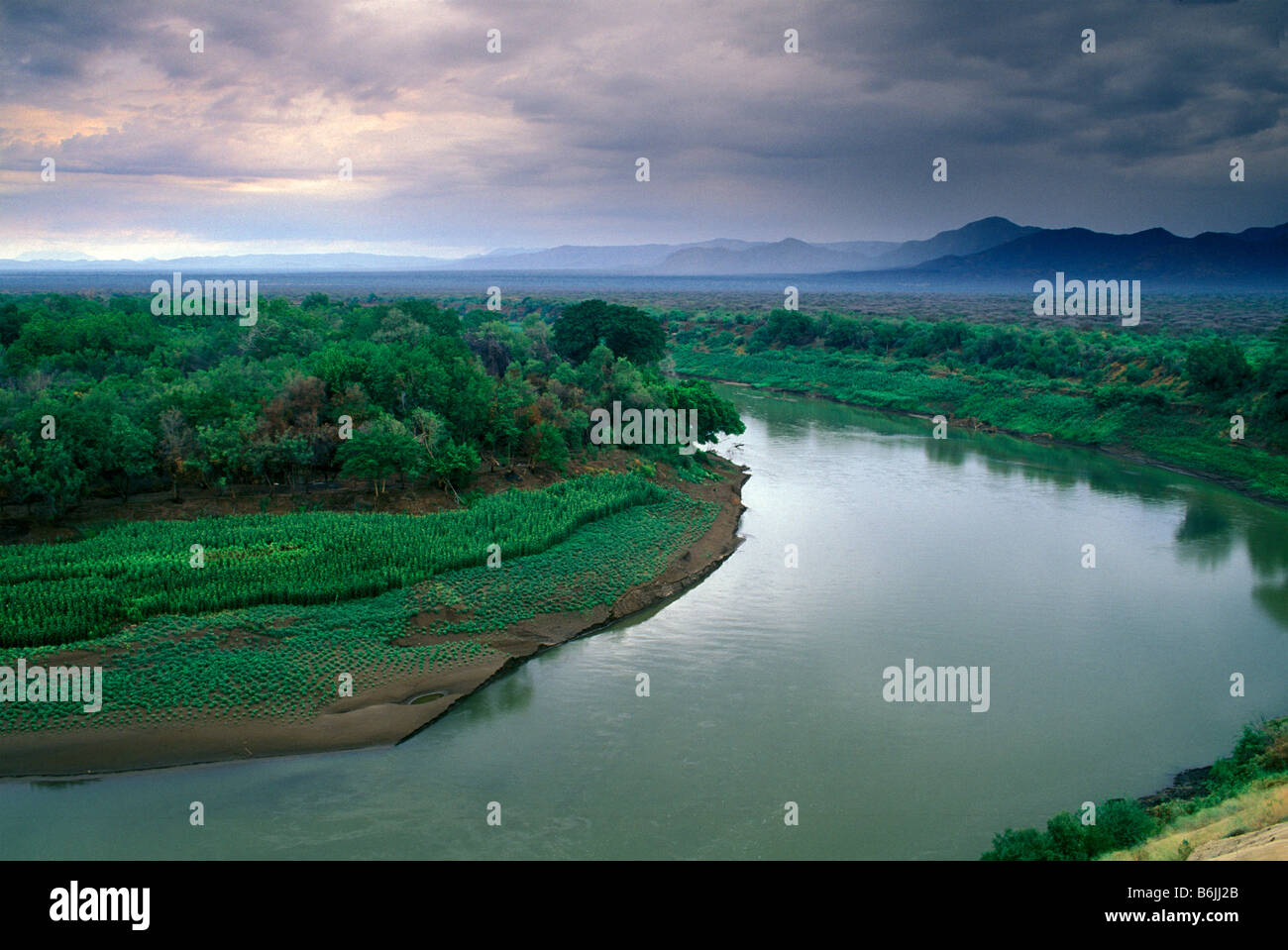 The Omo river flows by a Karo village in the Omo region of Ethiopia ...