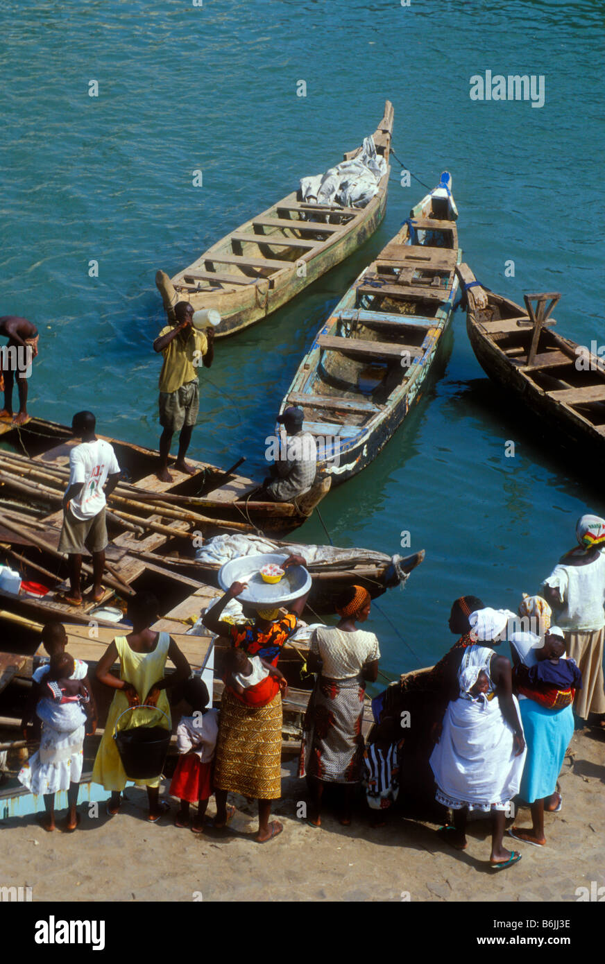 Ghana: Elmina, fishing port, Benya River, men on fishing boats returnng ...