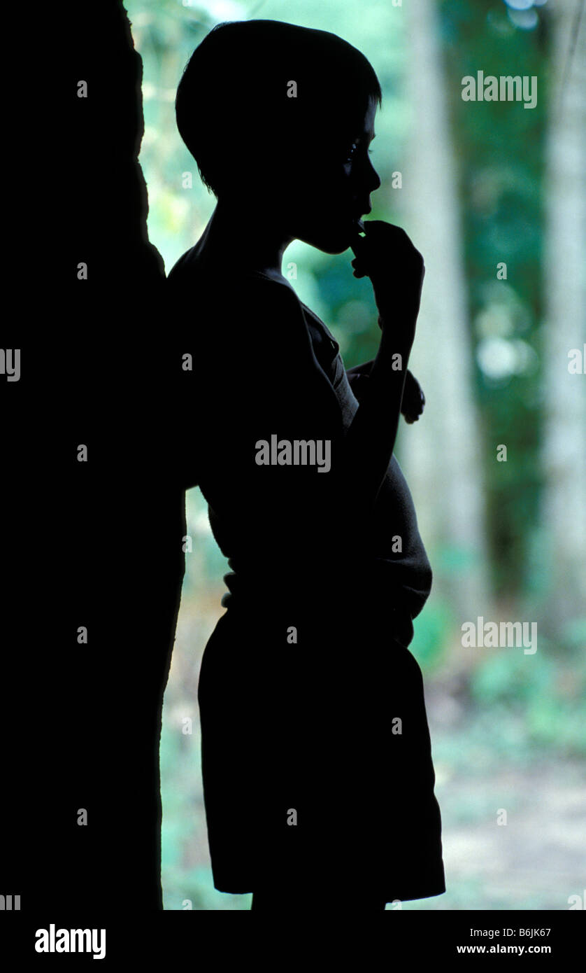 Asia, Laos A boy silhouetted in his rural home Stock Photo - Alamy