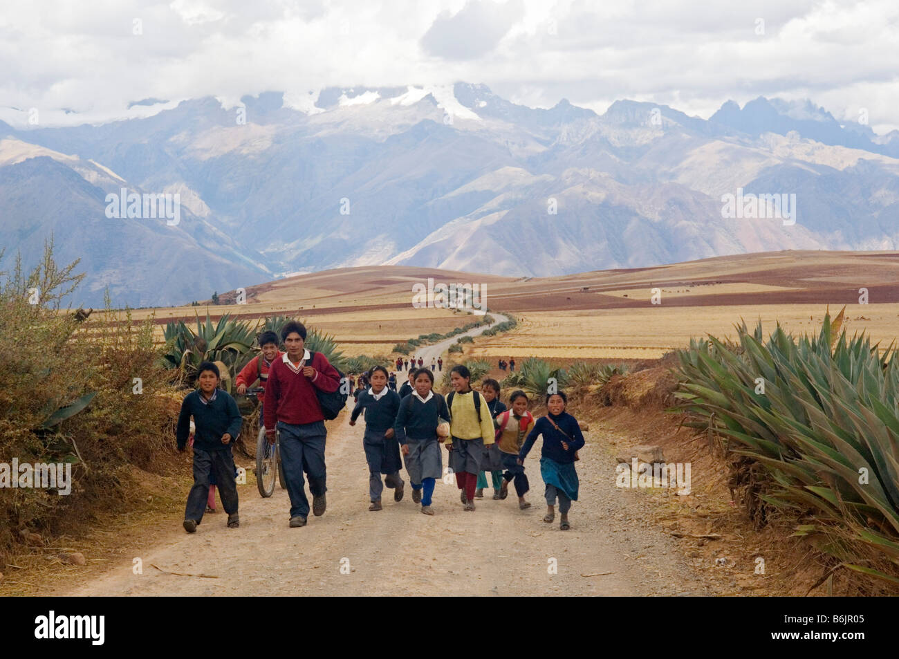 Peru, Children walking home from school with Andes in landscape Stock ...