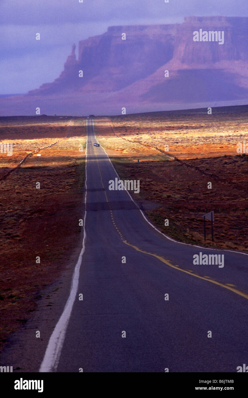 Straight road with desert waves heading for Monument Valley, Utah Stock ...