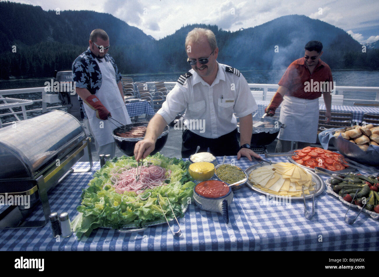 USA, Alaska. On-deck buffet, Adventure Expedition vessel Sea Bird ...