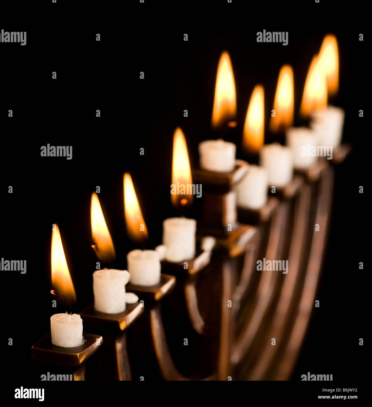 Beautiful lit hanukkah menorah on black Stock Photo - Alamy