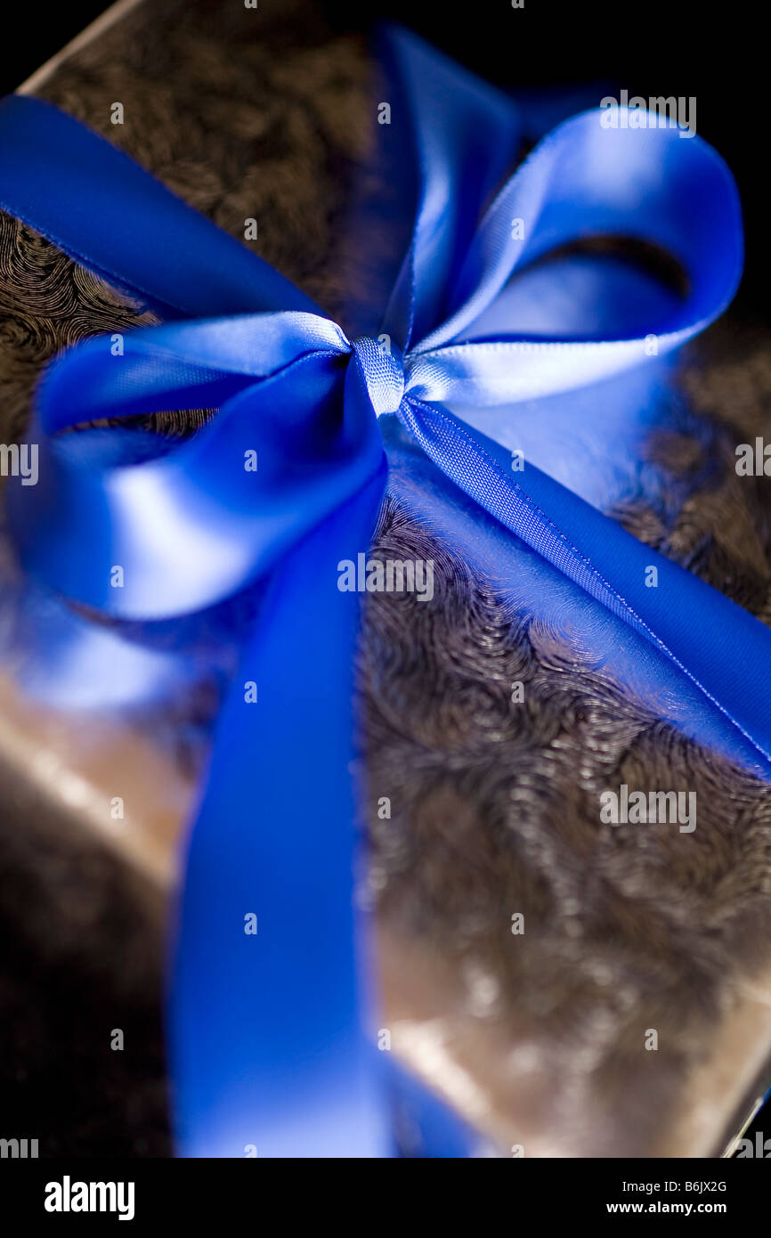 Blue Ribbon Tied in a Bow on Silver Gift High Resolution Image Shot ...