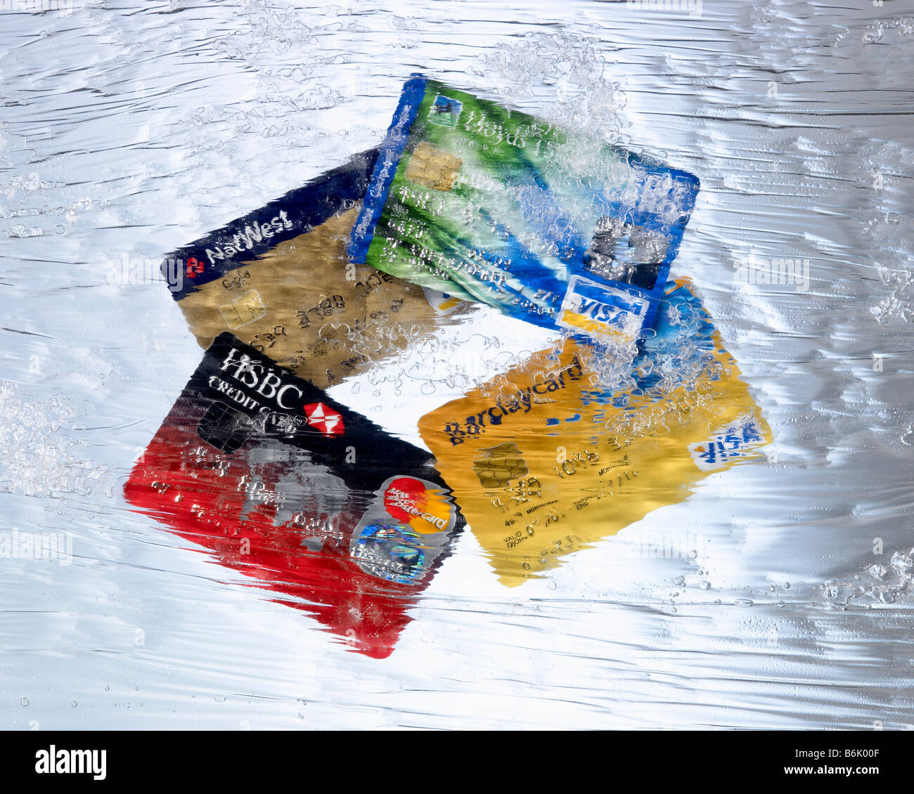 Credit Cards Frozen in Ice Stock Photo - Alamy