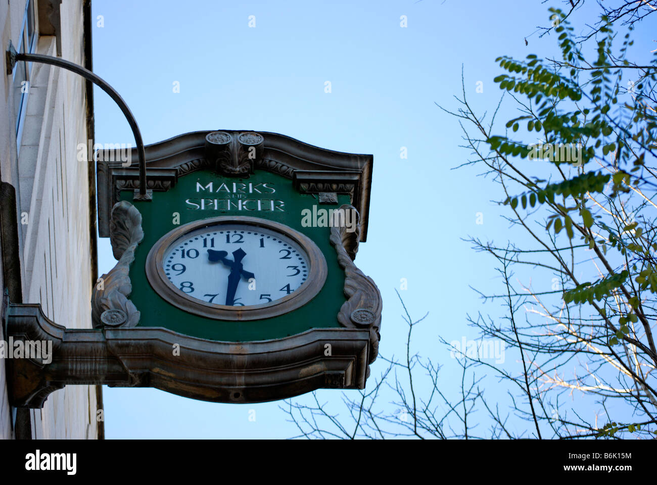 clock on exterior of marks and spencer store, hounslow high street ...