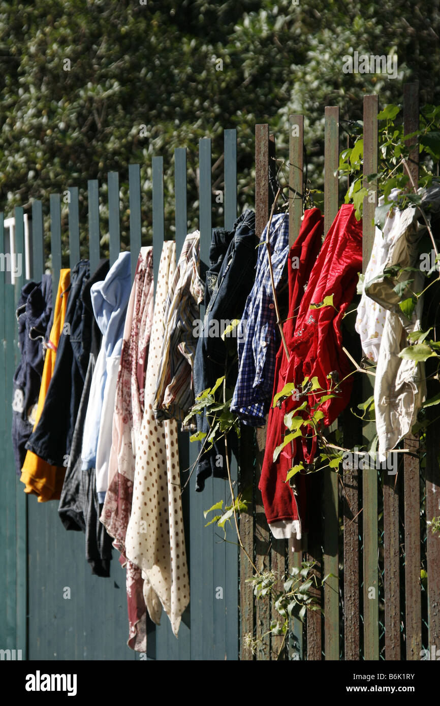homeless immigrant clothes on washing line fence in rome, italy Stock ...