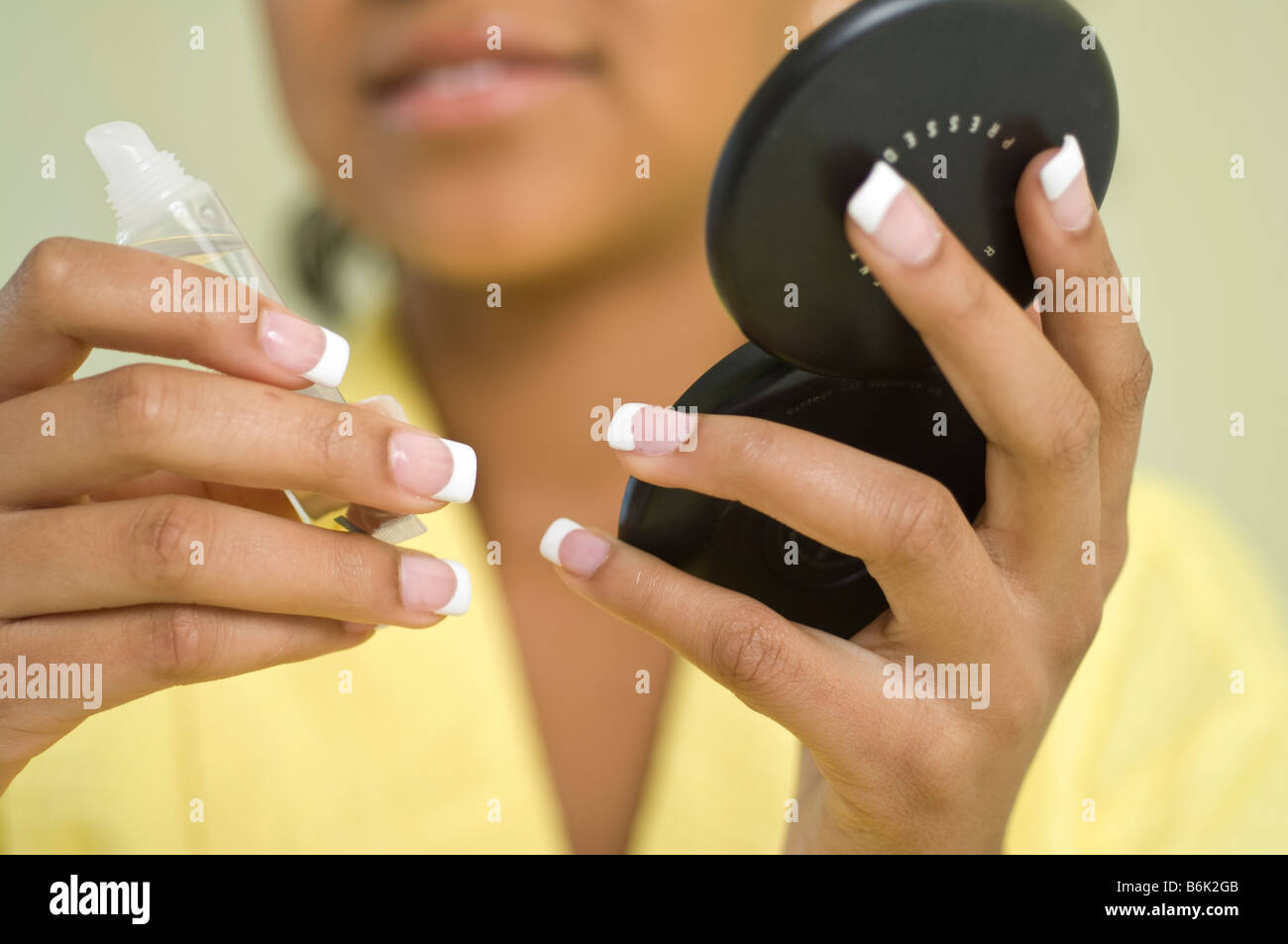Pampering in a yellow robe Stock Photo - Alamy