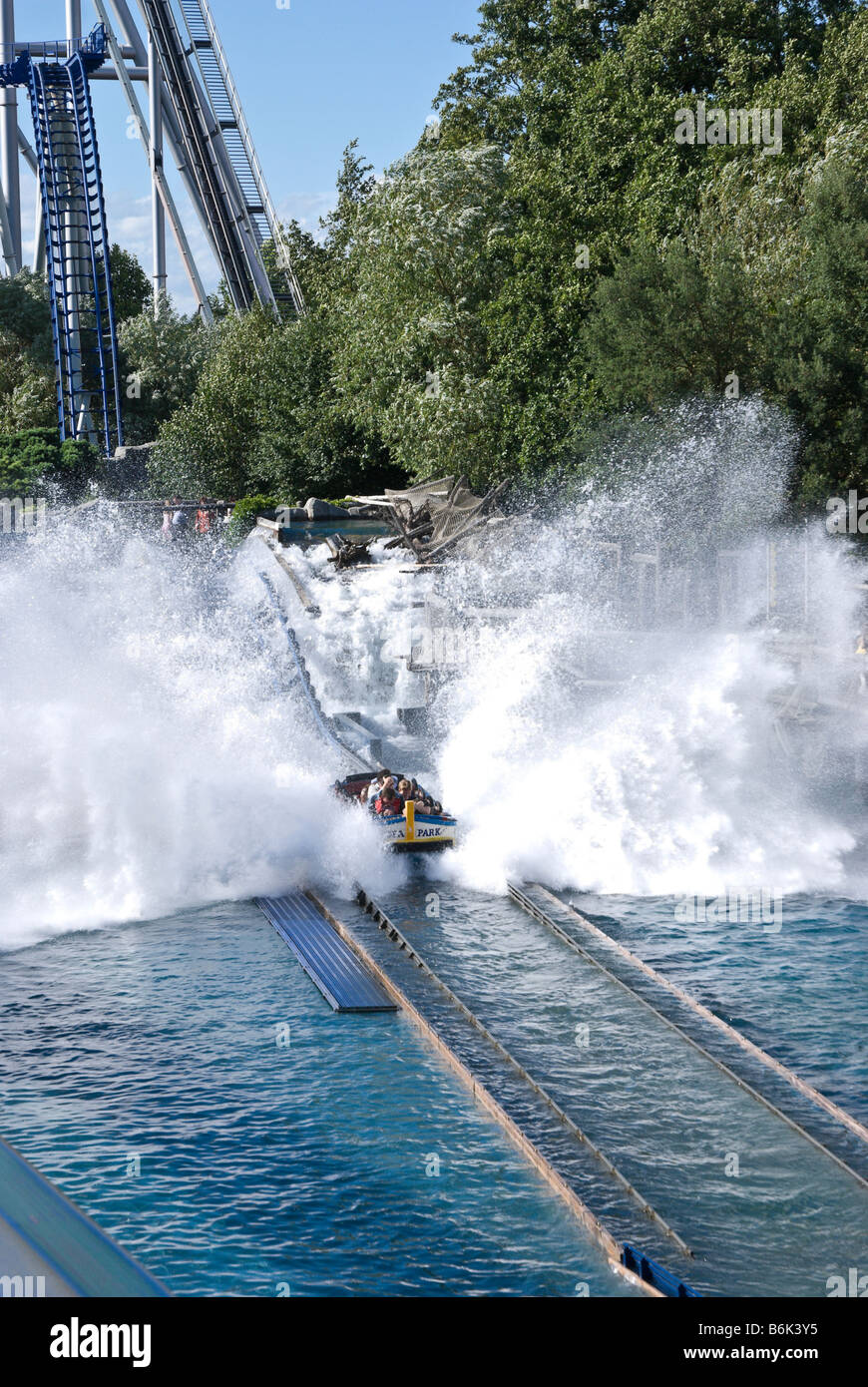 A boat plows over the rapids of the Poseidon roller coaster at Europa ...