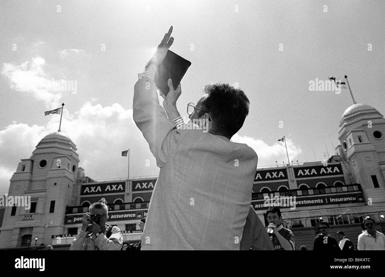Holding fa cup Black and White Stock Photos & Images - Alamy
