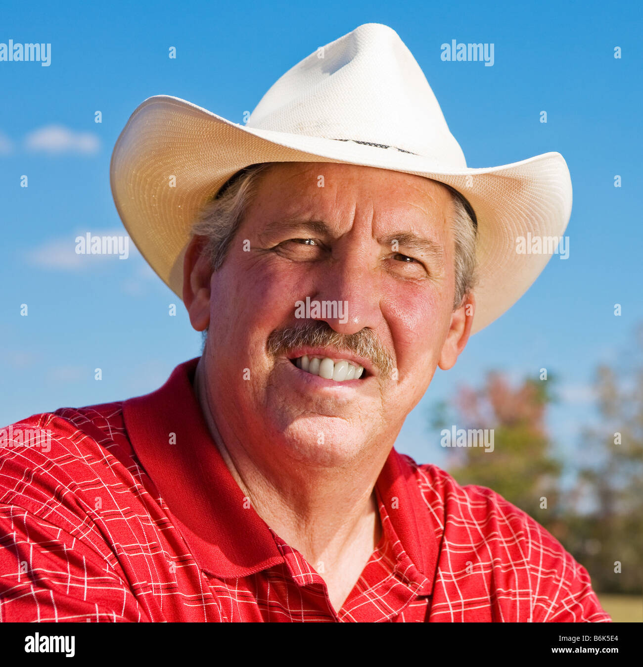 Portrait of a handsome mature cowboy outdoors Stock Photo - Alamy
