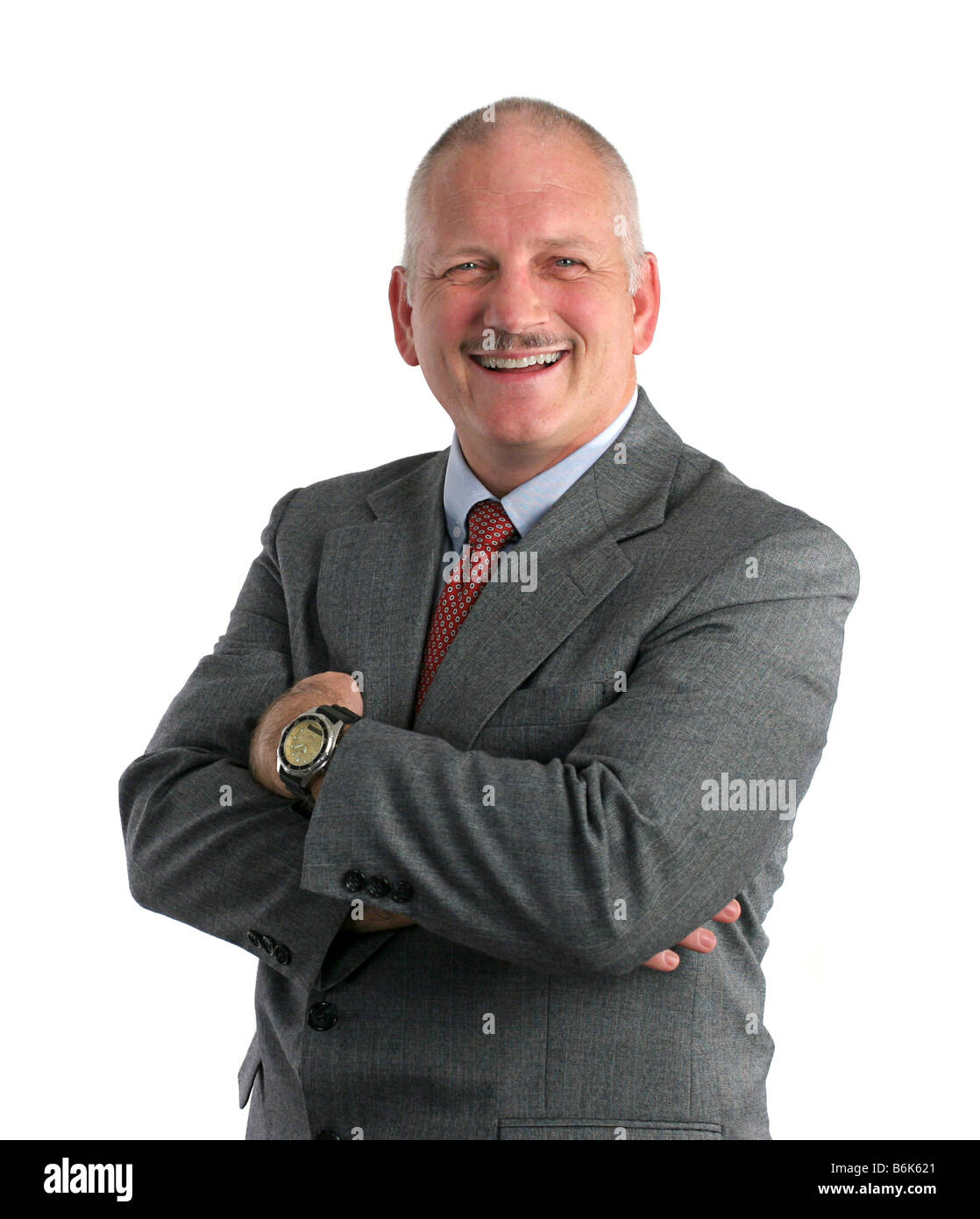 a friendly looking man in a suit with his arms crossed room for text ...