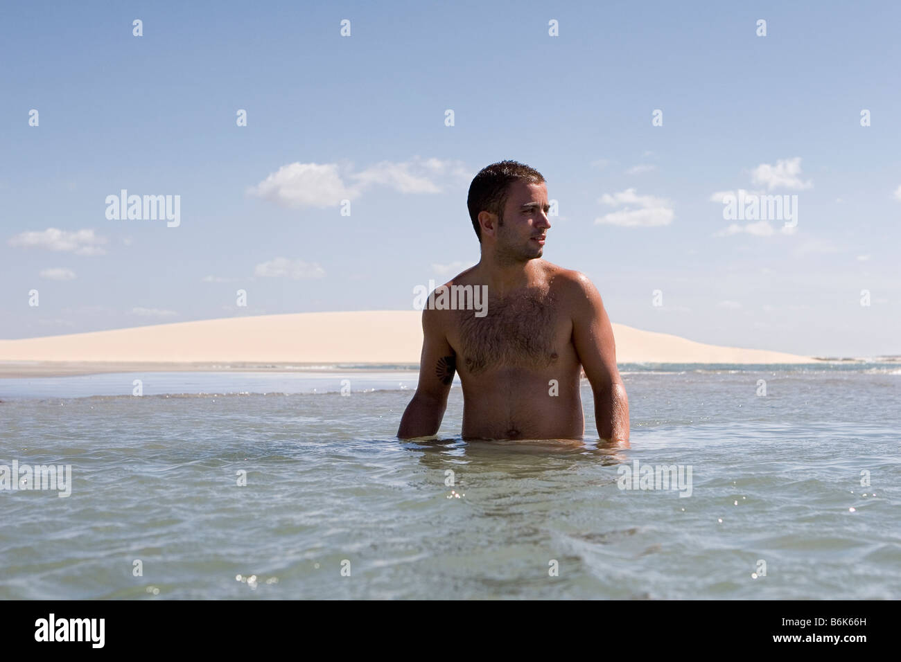 A man taking a bath in the beach Stock Photo - Alamy