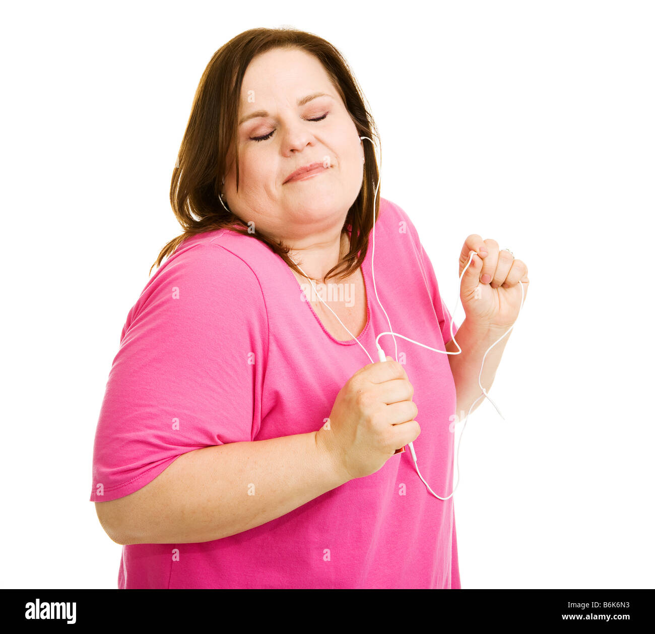 Pretty plus sized model dancing to the music from her mp3 player ...