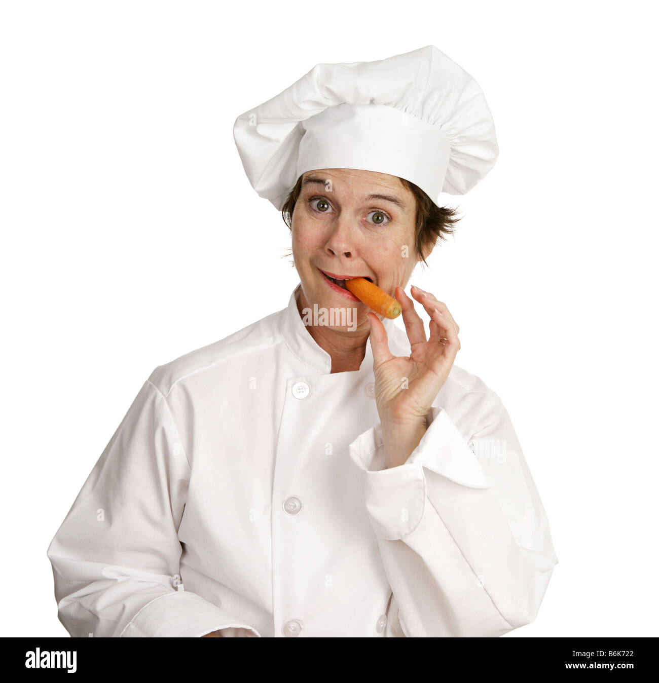 A cute female chef eating a carrot like its a cigar Isolated on white ...