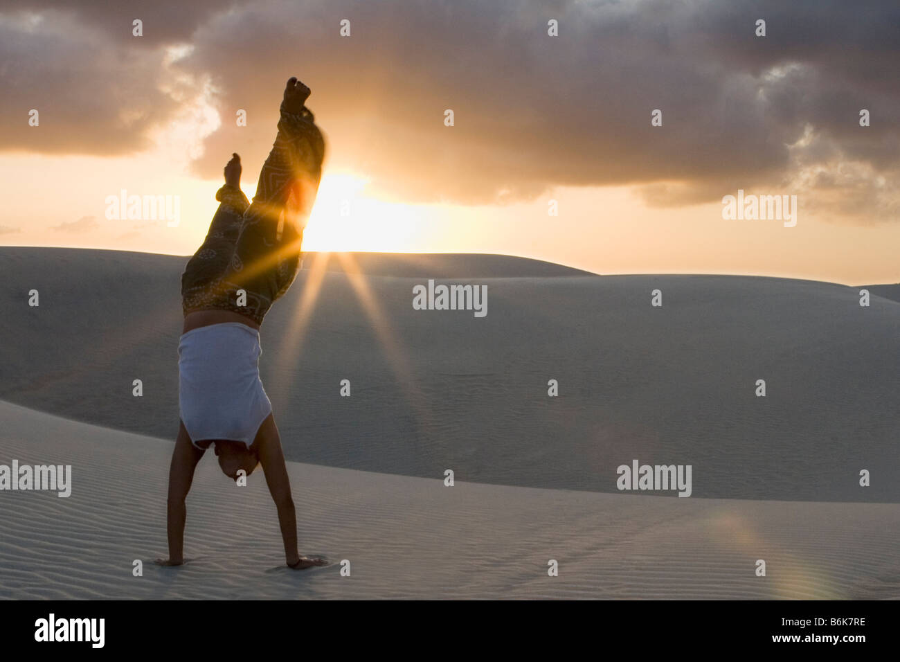 woman doing a handstand on the beach Stock Photo - Alamy
