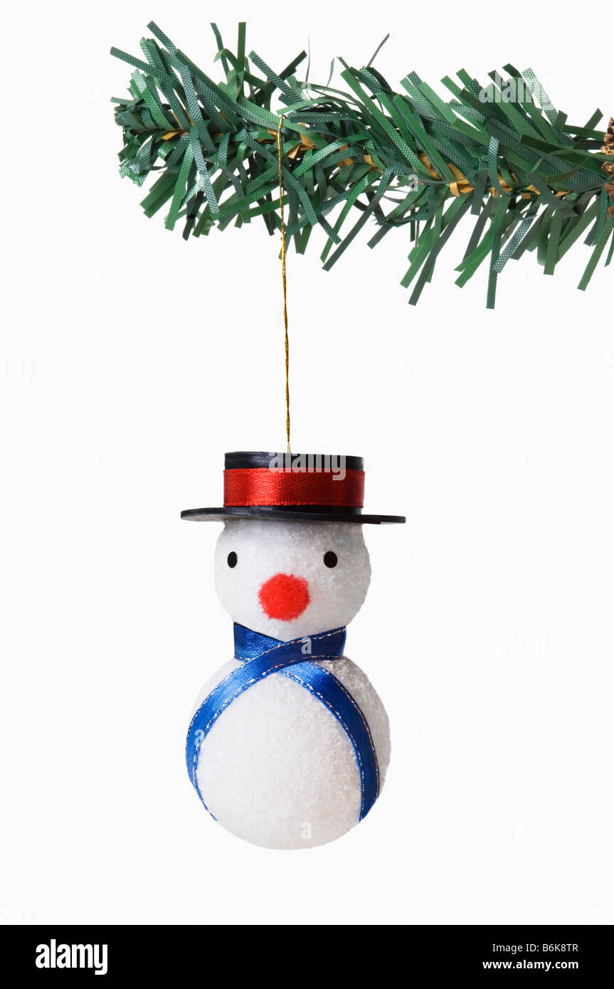 Snowman hanging on a Christmas tree Stock Photo - Alamy