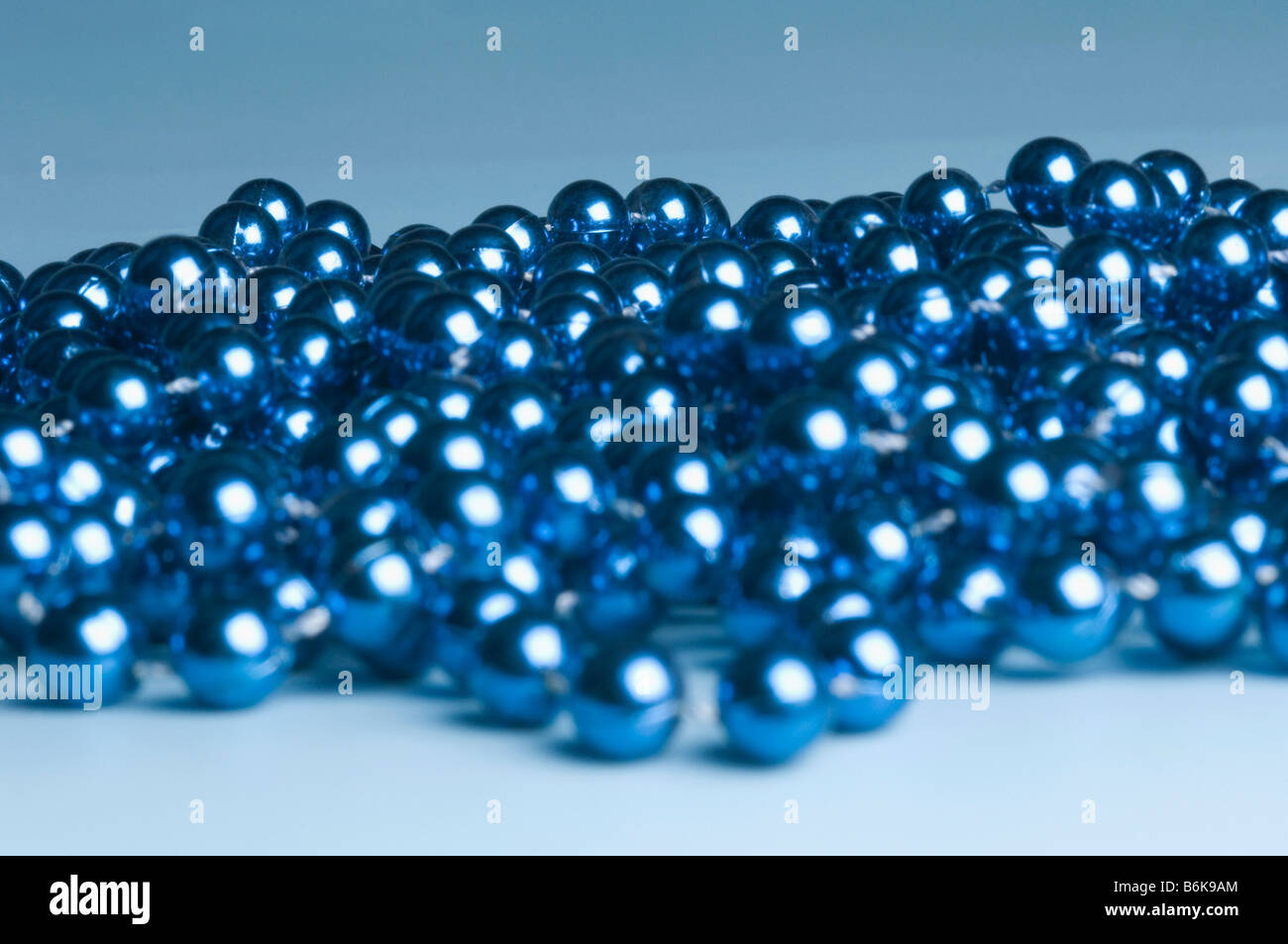 Close-up of a string of blue beads Stock Photo - Alamy