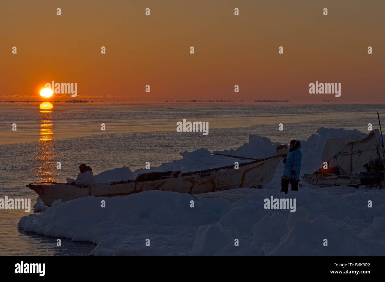 Inupiaq subsistence whalers with a seal skin boat or umiak and wind ...