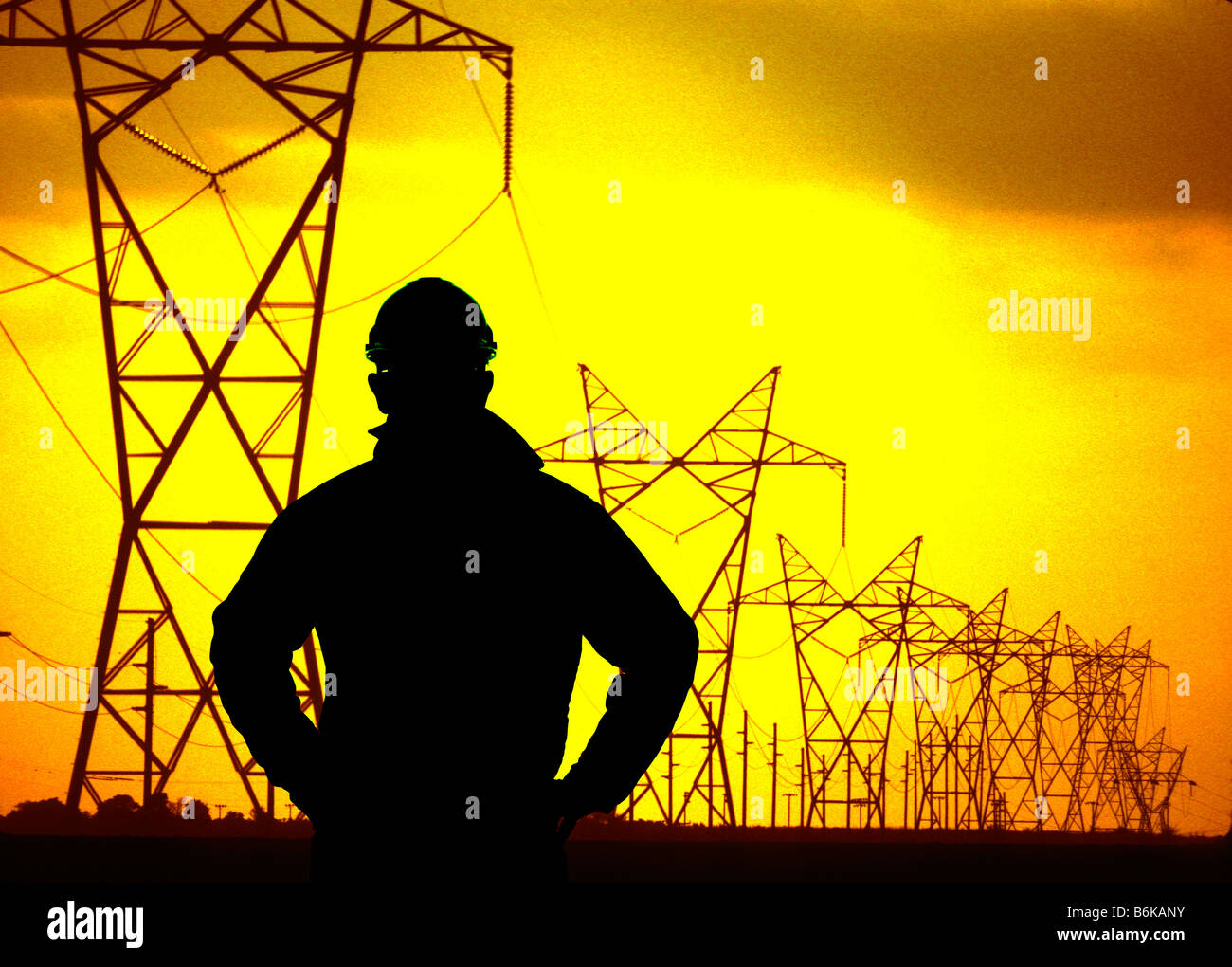 power manager checking on large power transmission lines and towers ...