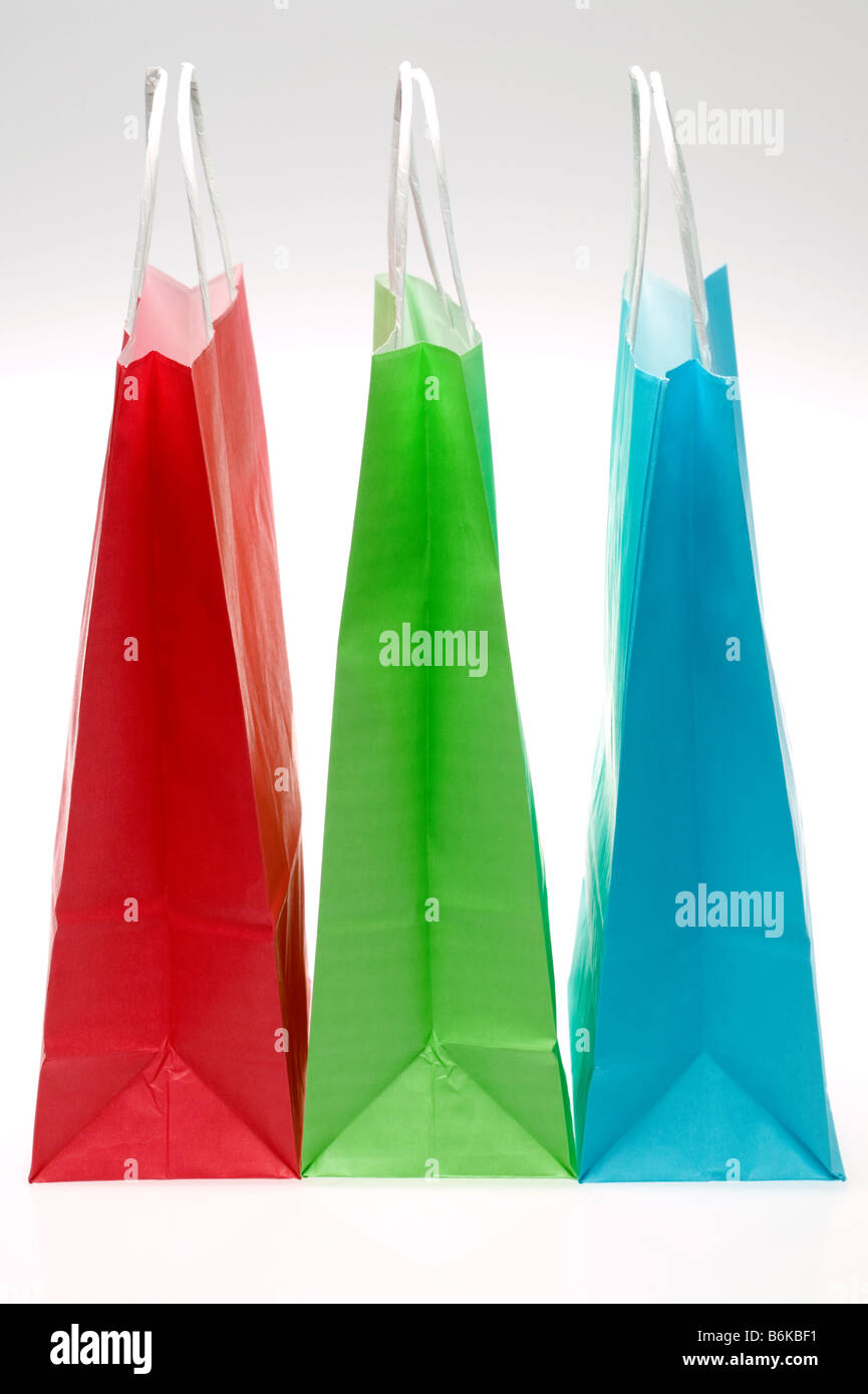 Three colourful paper shopping bags Stock Photo - Alamy