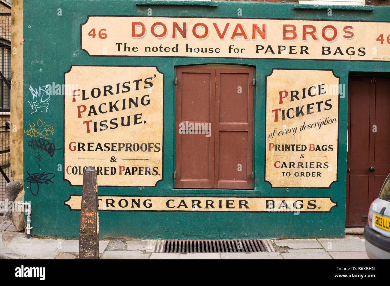 hand painted advertisement for paper bags on front of building Stock ...