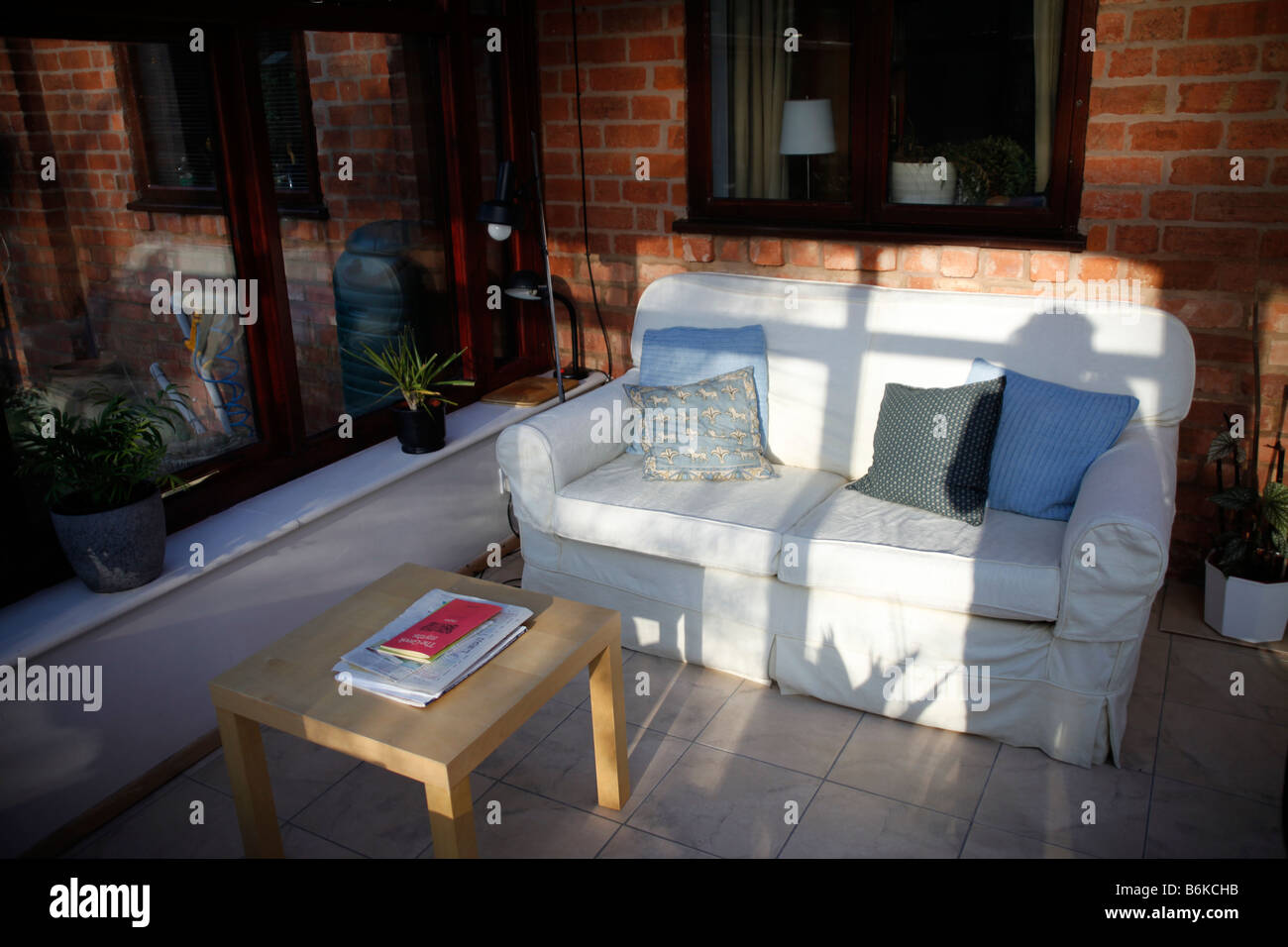 conservatory tables chairs plants room in house next to garden Stock ...