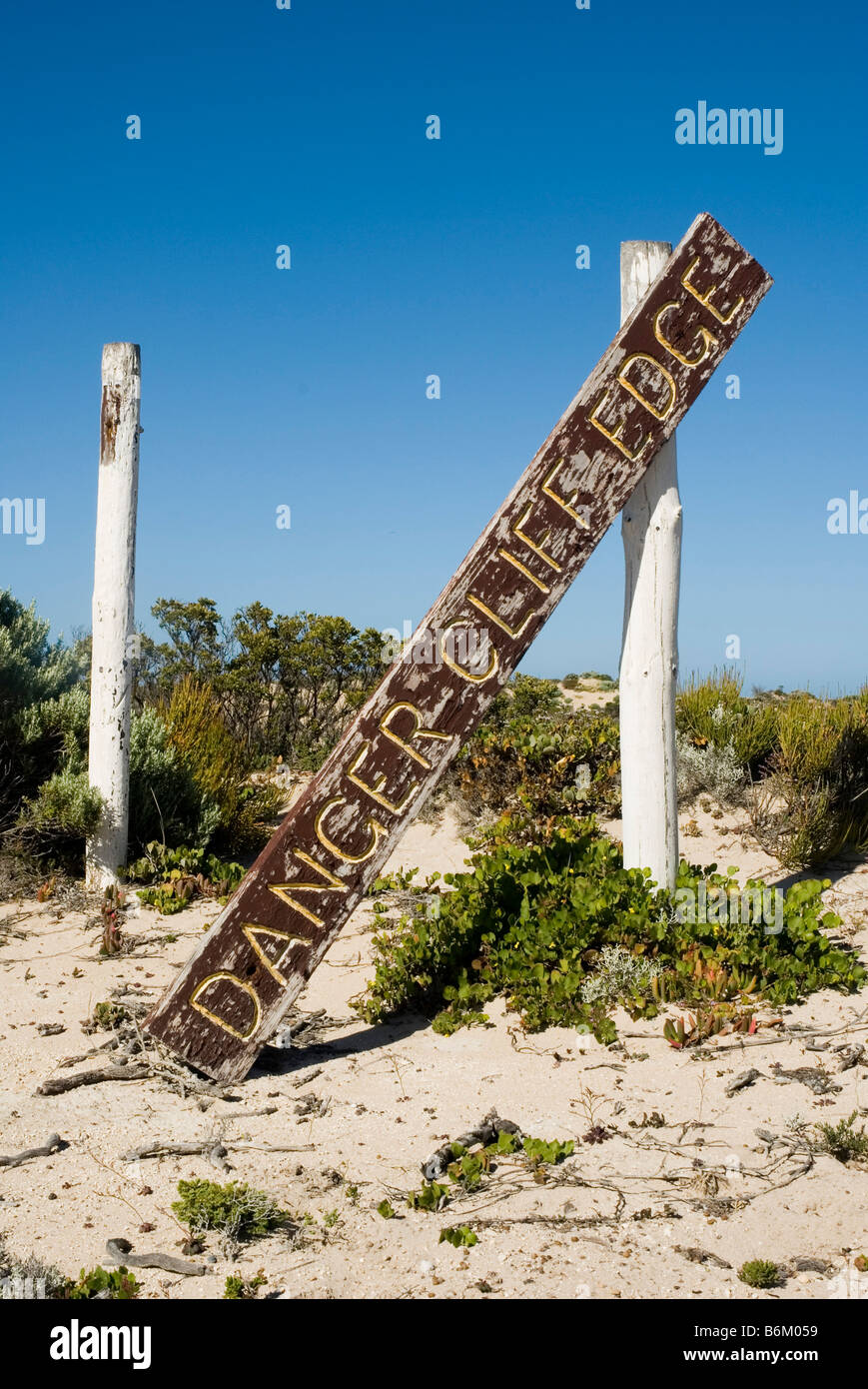 Danger cliff edge warning sign Stock Photo - Alamy