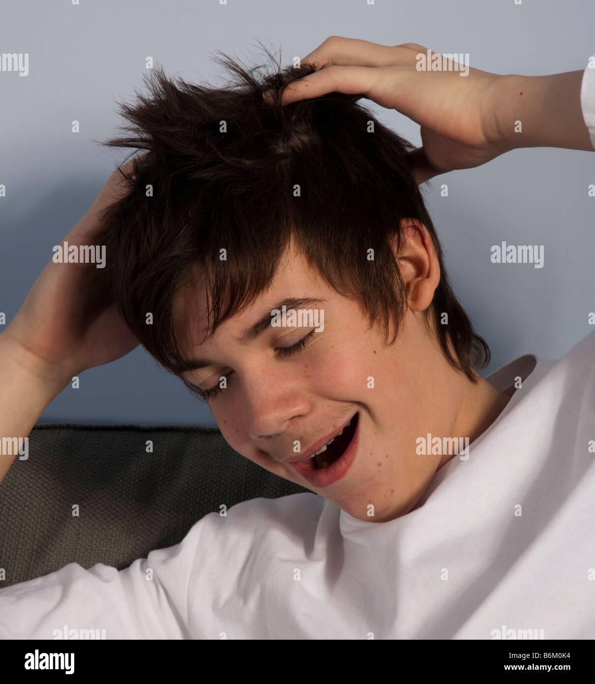 Teen boy sleeping on couch hi-res stock photography and images - Alamy