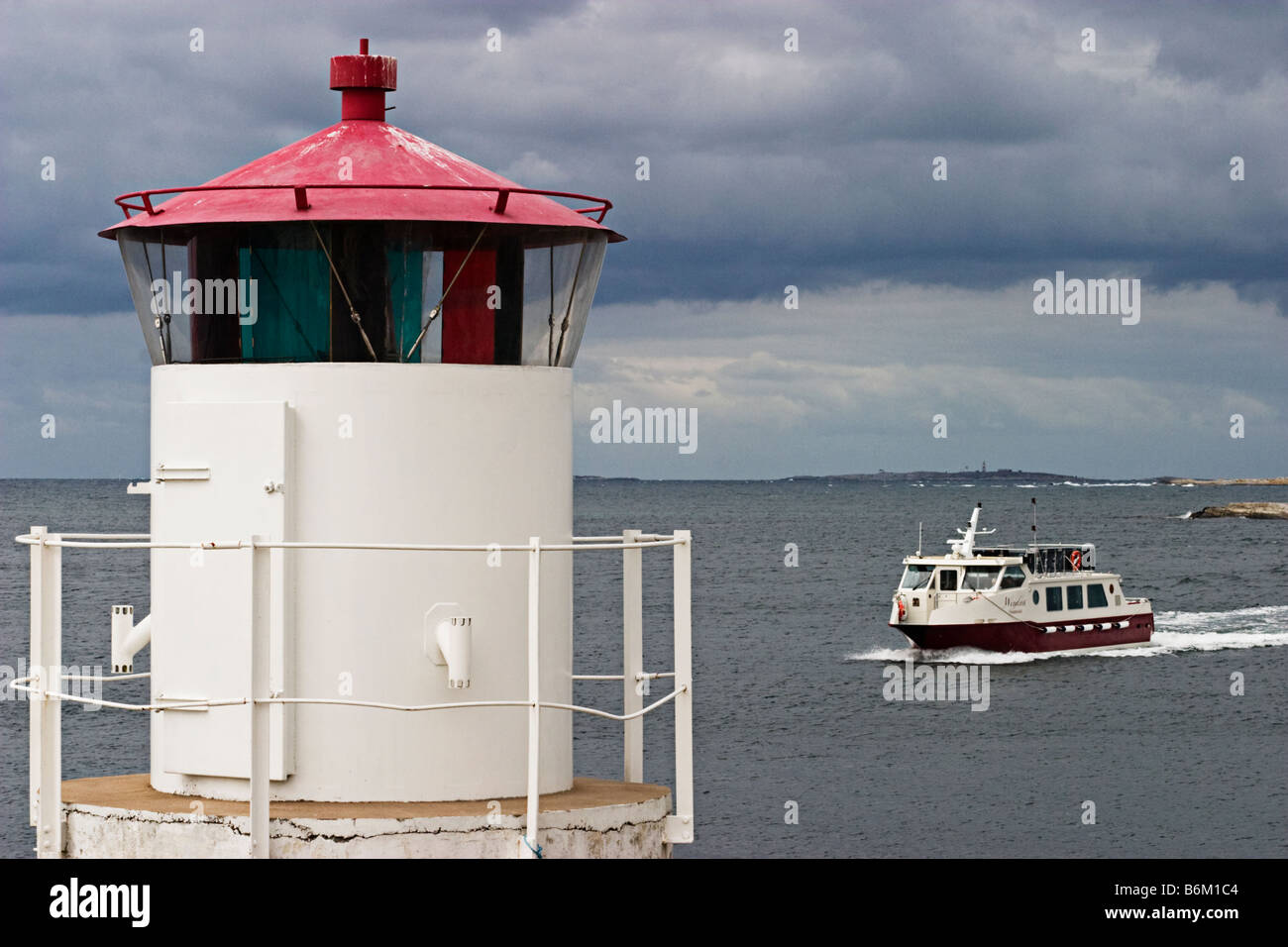 Lighthouse at the coast in bad summer weather Stock Photo - Alamy