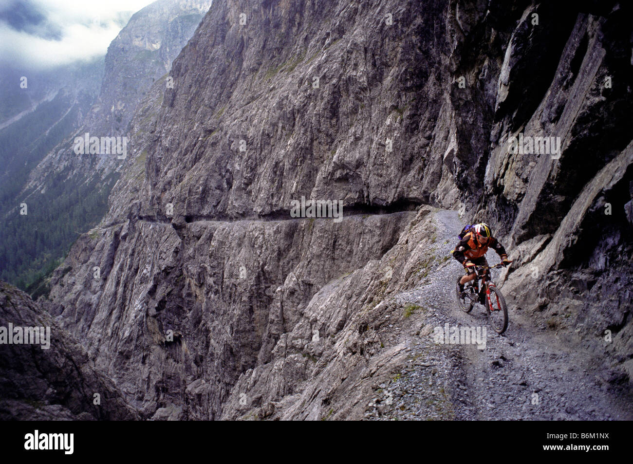 World Champion adventure mountain biker, Hans Rey, riding in Val d'Uina ...