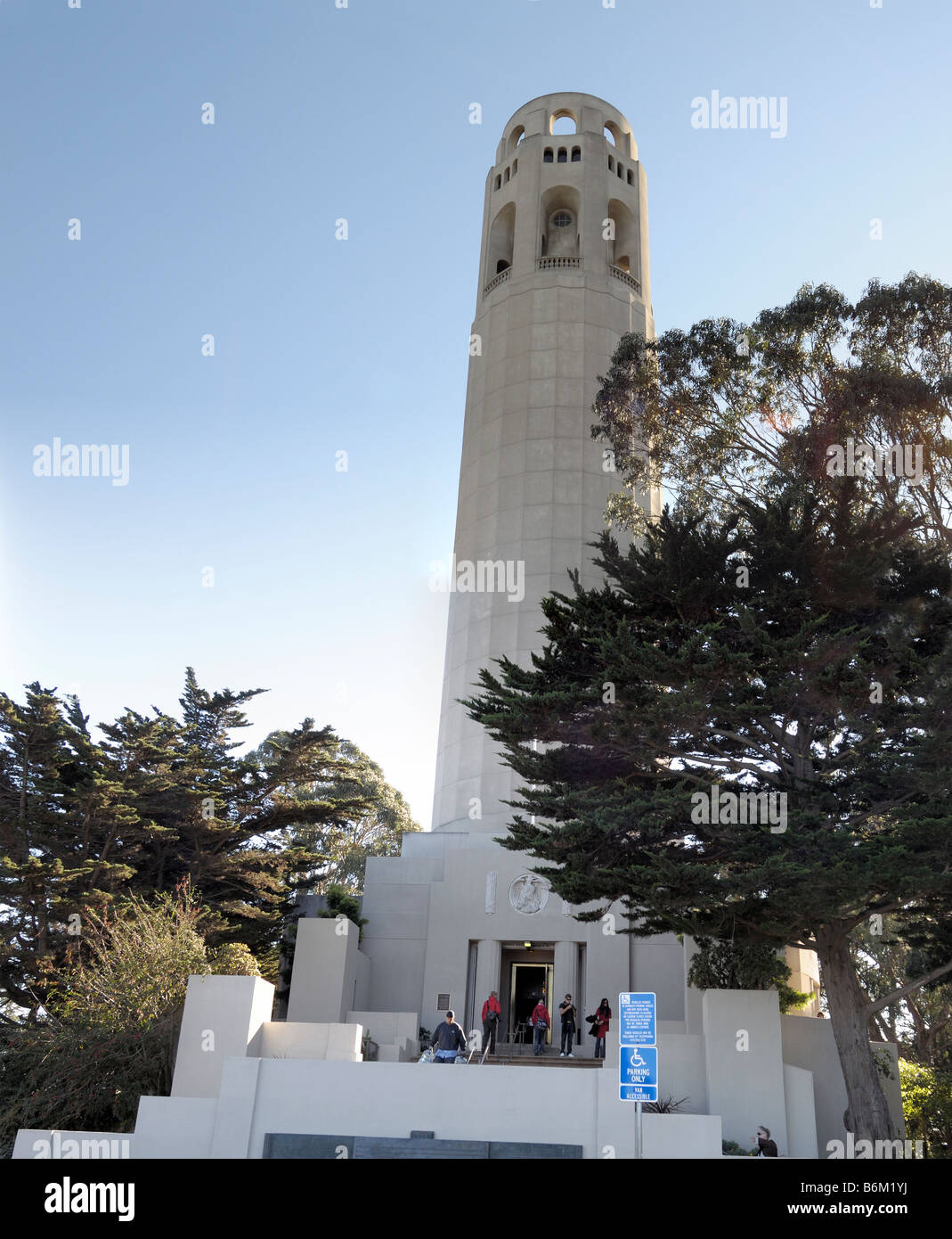 The Coit Tower stands as a tall fluted concrete column under a blue sky ...