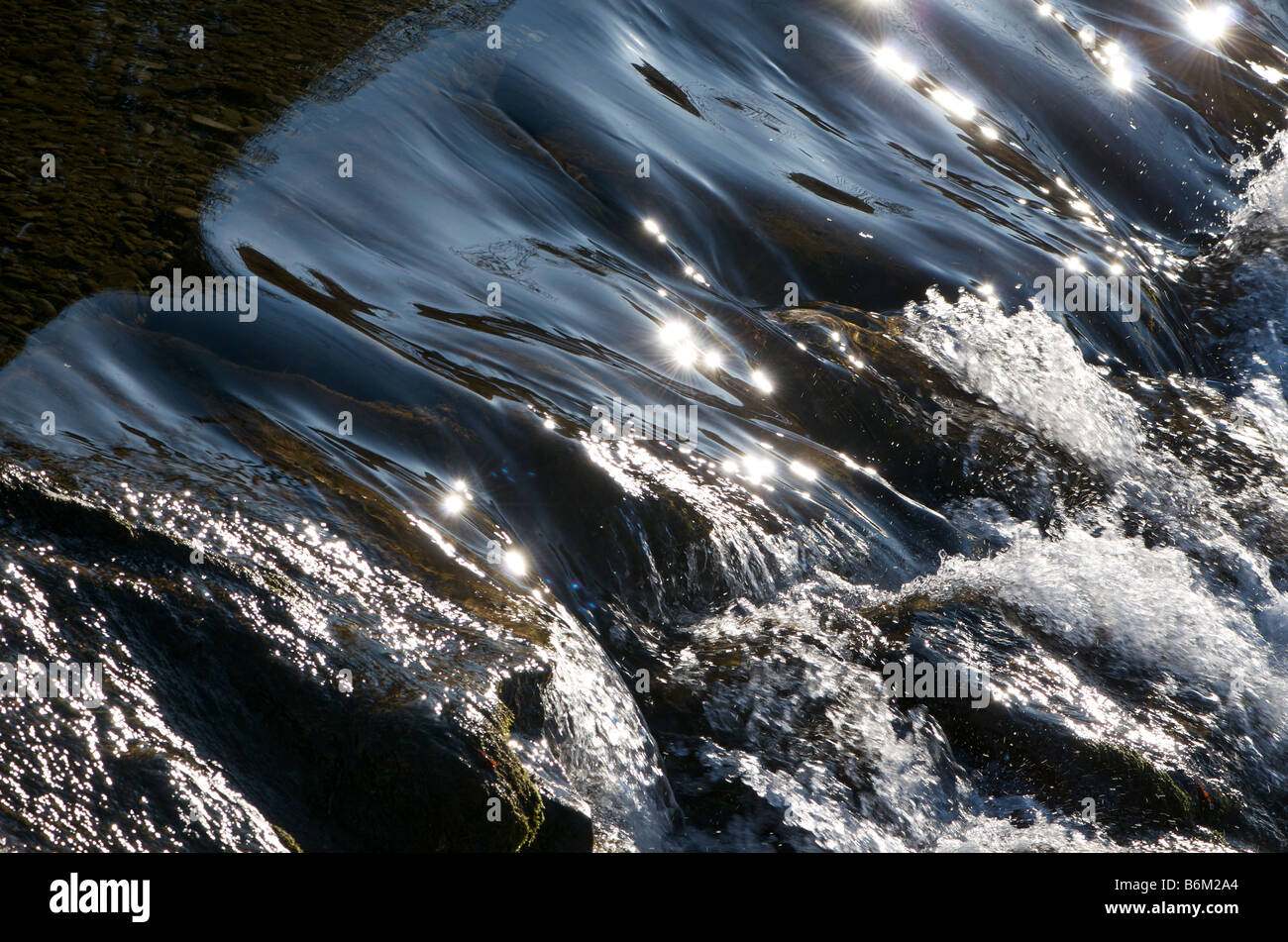flowing water on a small cascade Stock Photo - Alamy