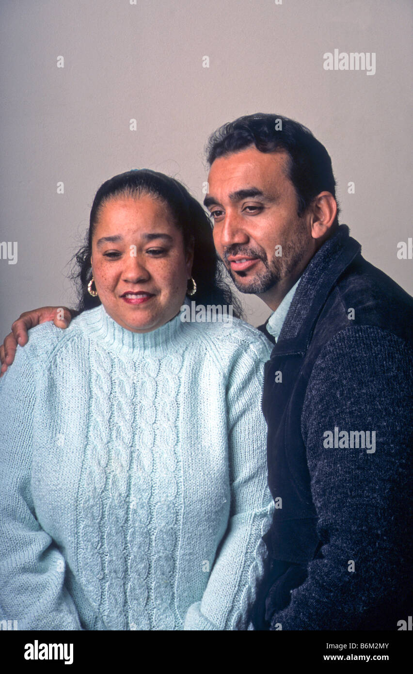 Hispanic couple look concerned Stock Photo - Alamy