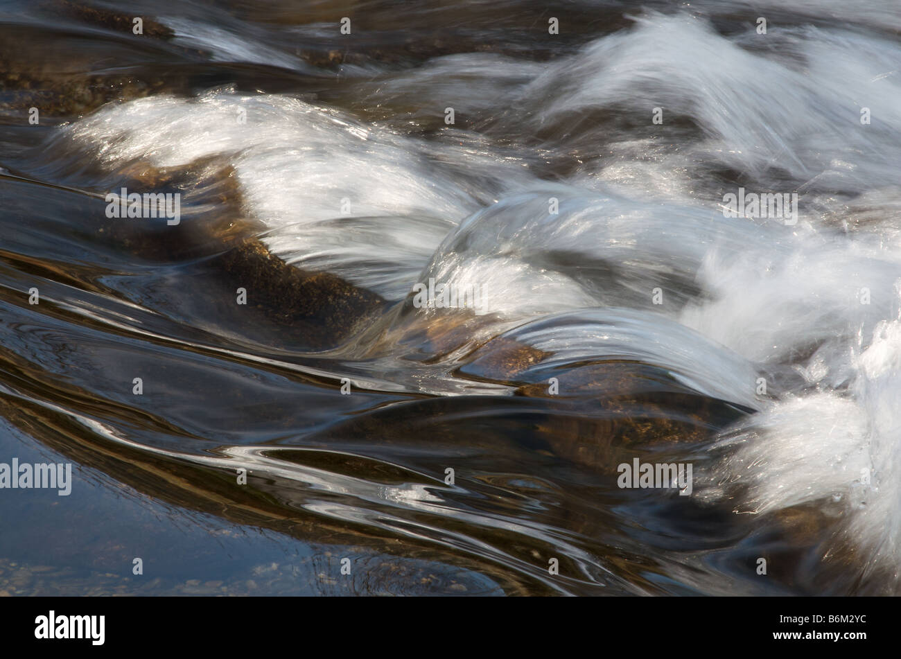 flowing water on a small cascade Stock Photo - Alamy