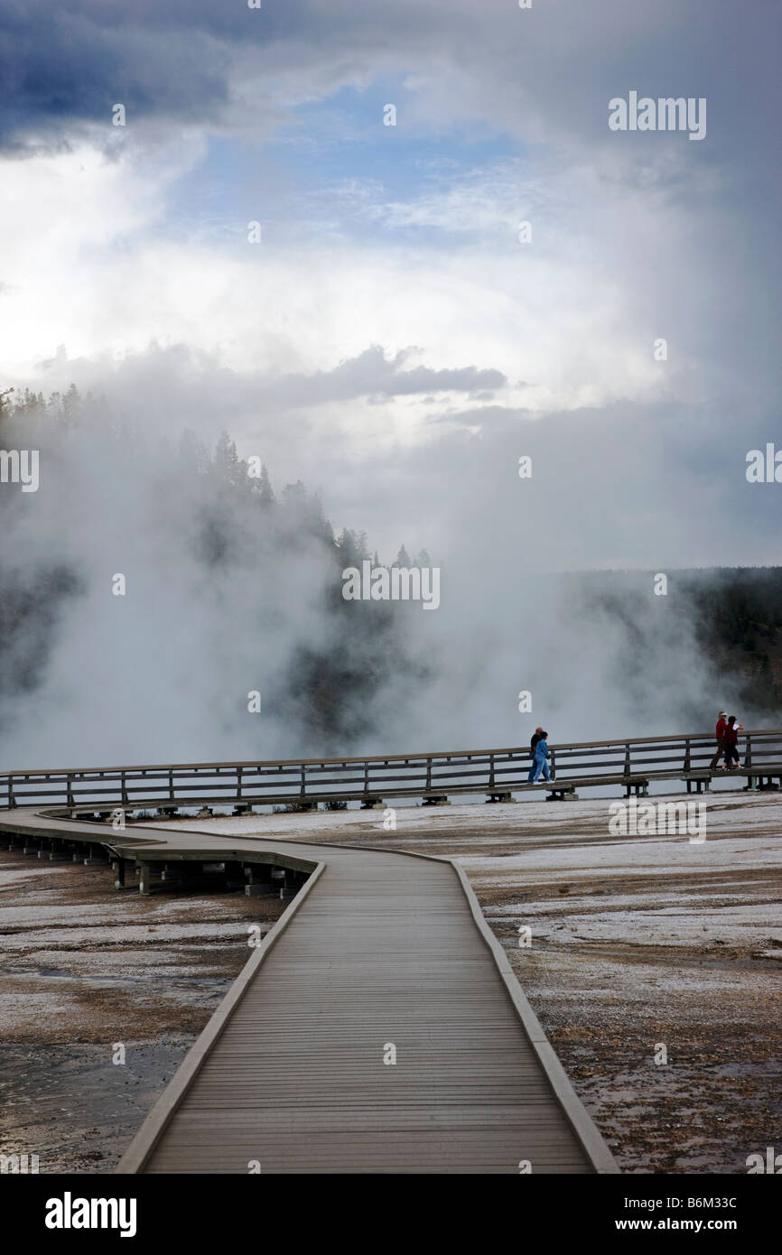 Visitors walk the boardwalk at the Grand Prismatic Spring, Midway ...