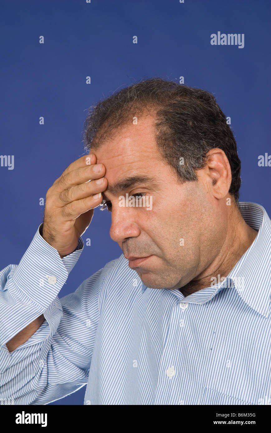 Man head in hand Stock Photo - Alamy