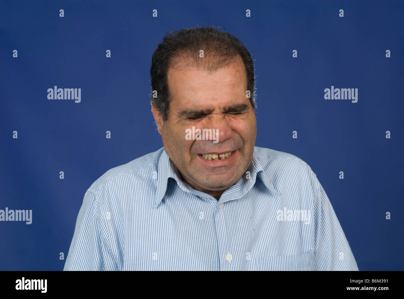 Man with annoyed facial expression Stock Photo - Alamy