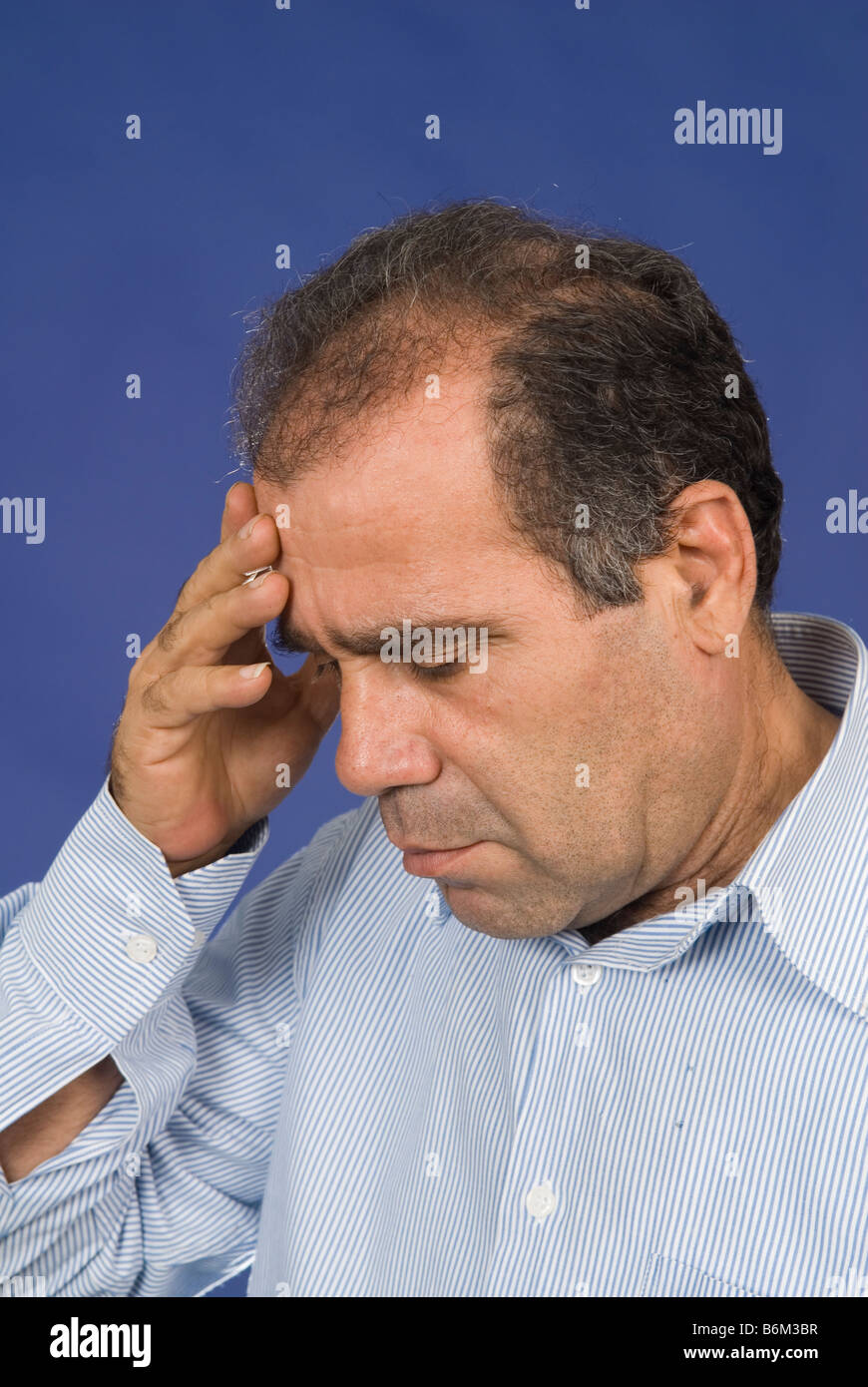Man head in hand Stock Photo - Alamy