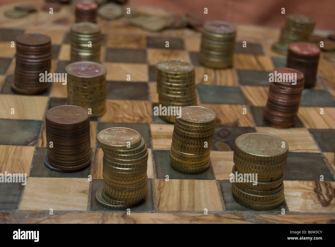 recession.a chessboard with coins Stock Photo - Alamy