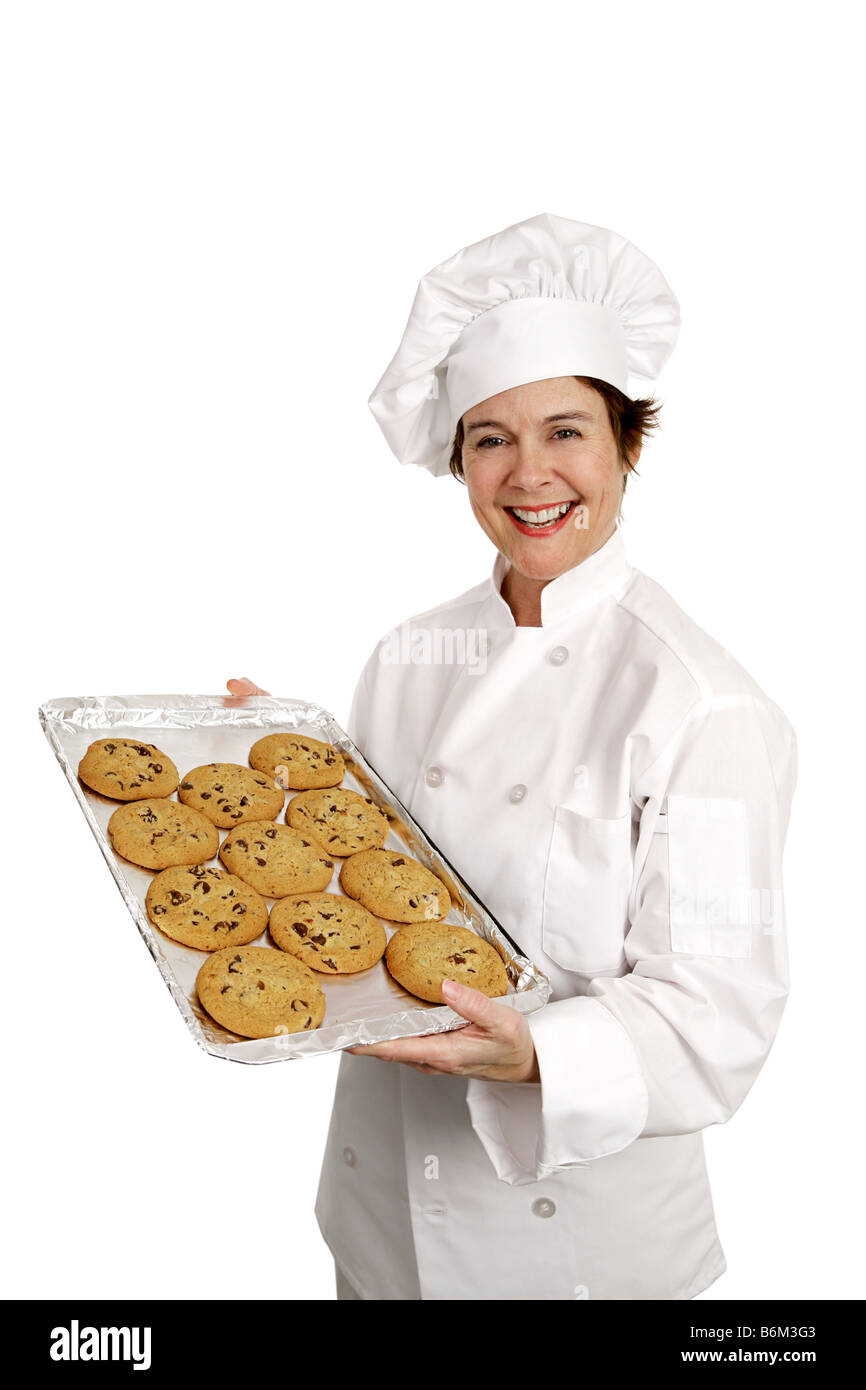 Three quarter view of a happy smiling bakery chef holding a tray of ...