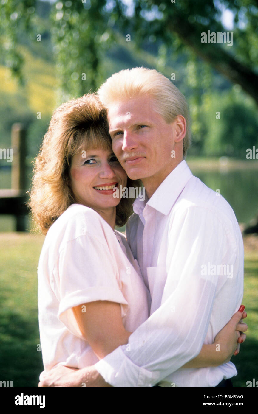 Adult couple with pleasant expressions on face Stock Photo - Alamy