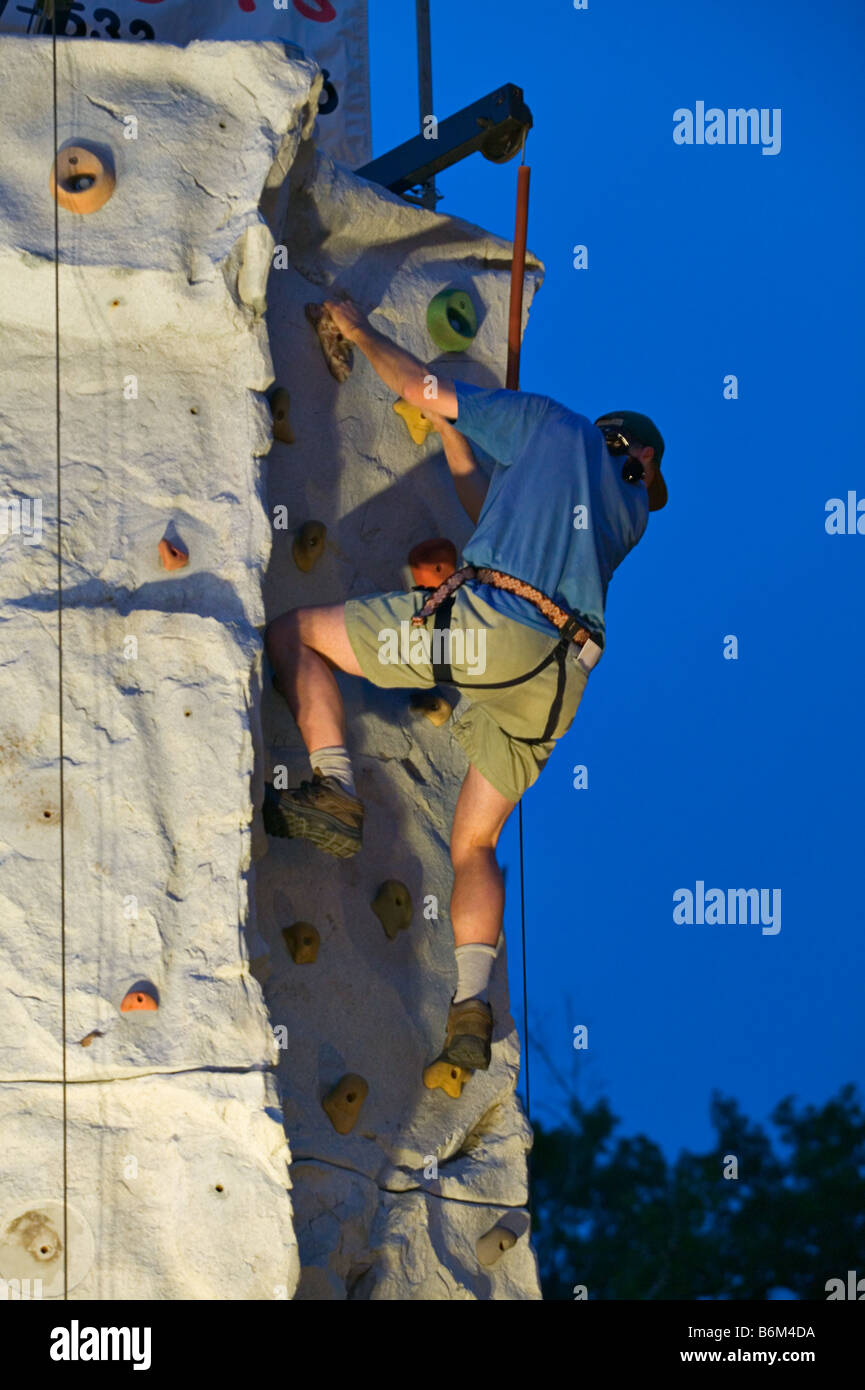 Looking down from the top a climber summits a rock wall Stock Photo - Alamy