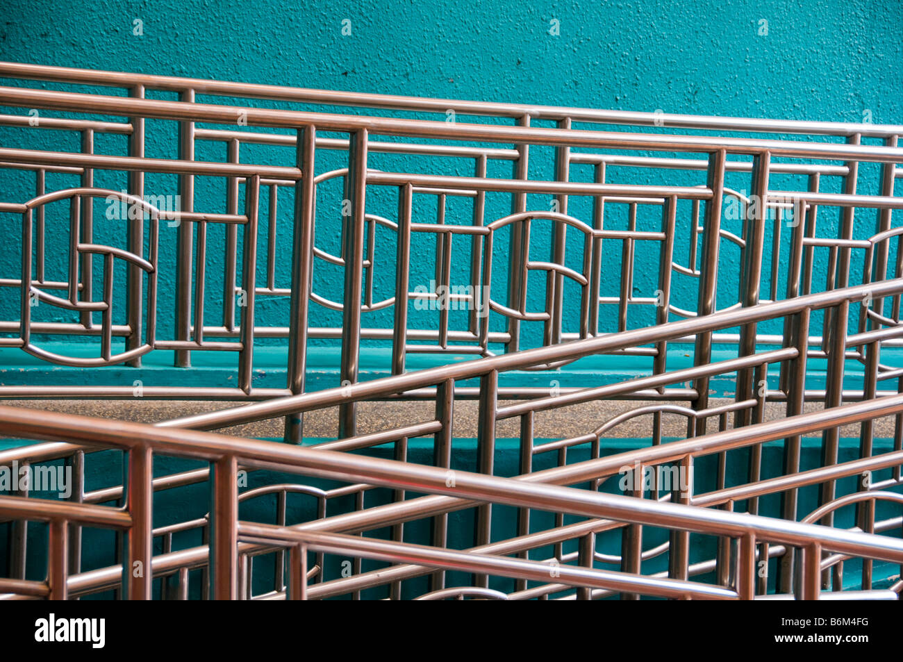Metal handrail to guide people through lines Stock Photo - Alamy