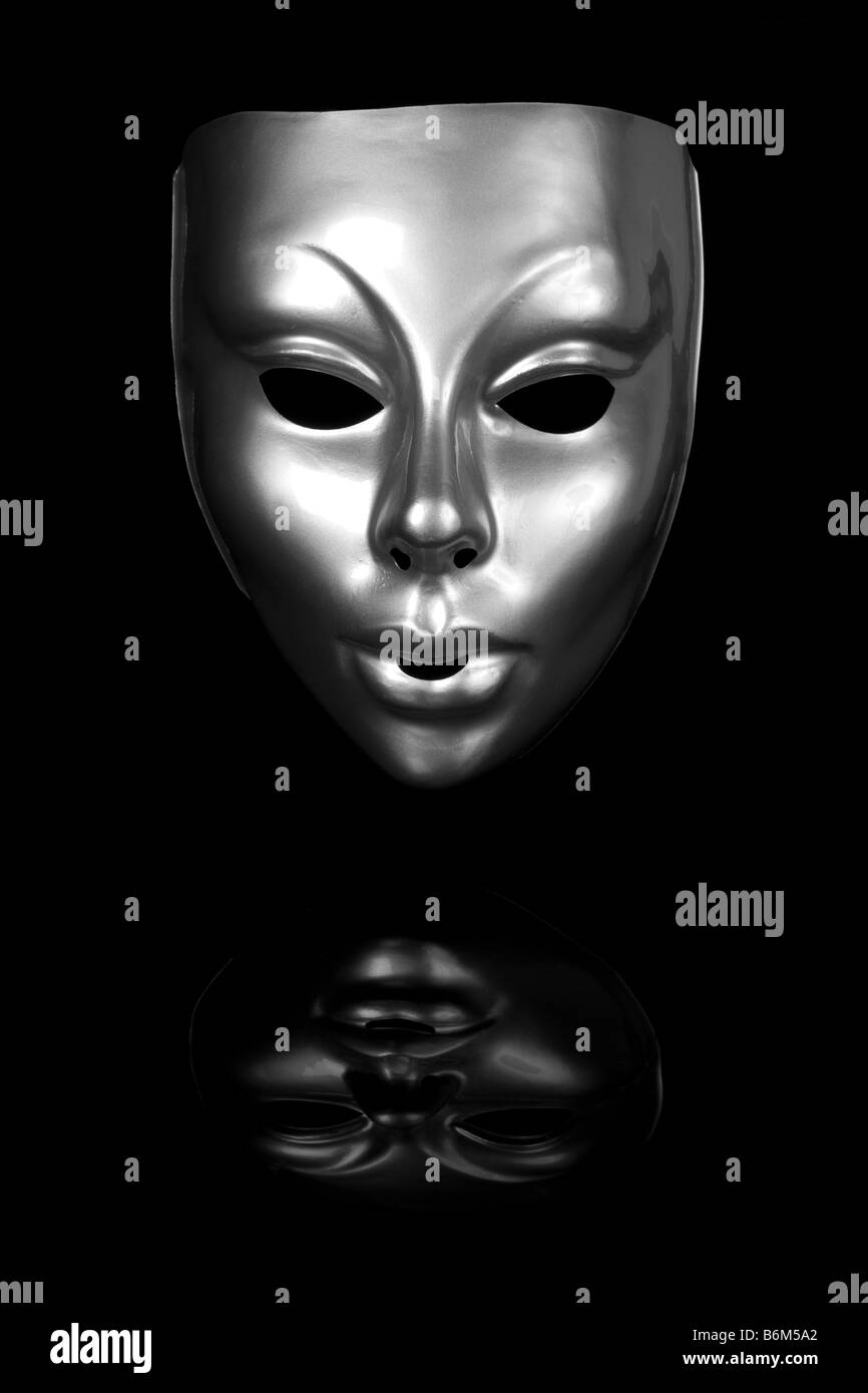 Silver mask isolated on black background Stock Photo - Alamy