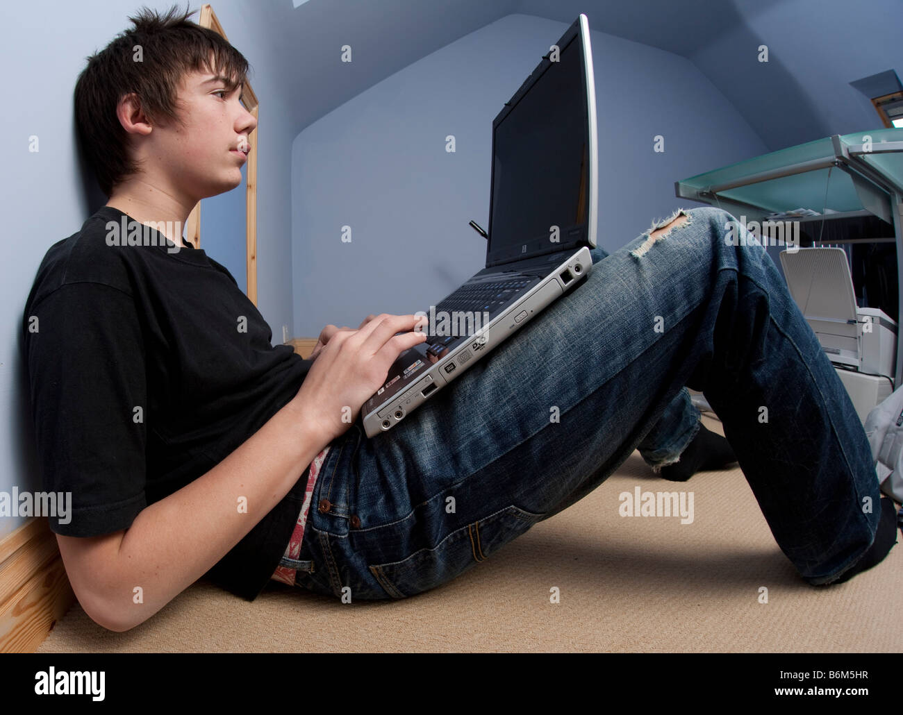13 year old boy teenager with laptop computer Stock Photo - Alamy