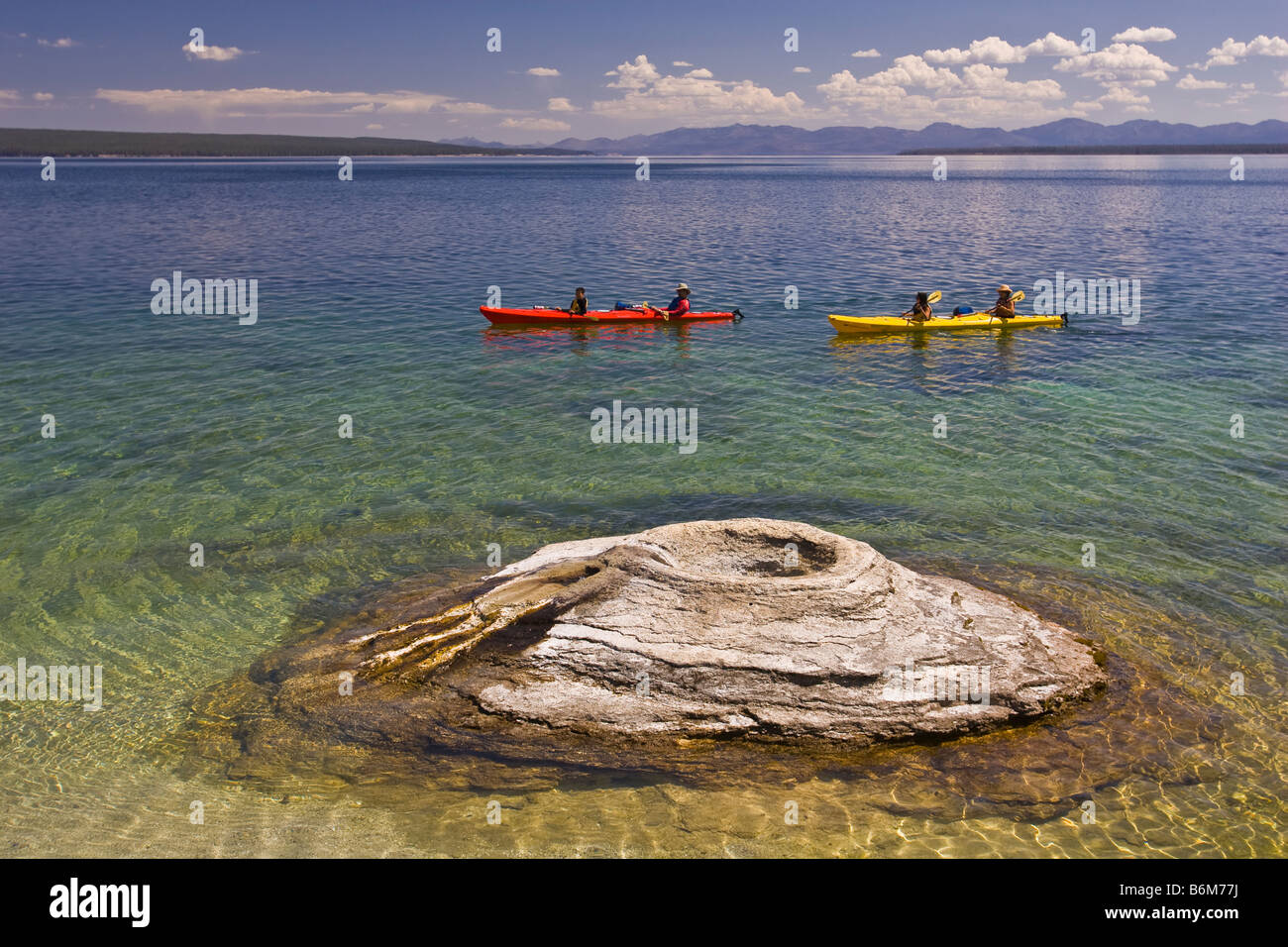 YELLOWSTONE NATIONAL PARK, WYOMING, USA - Tourists in kayaks paddle by ...